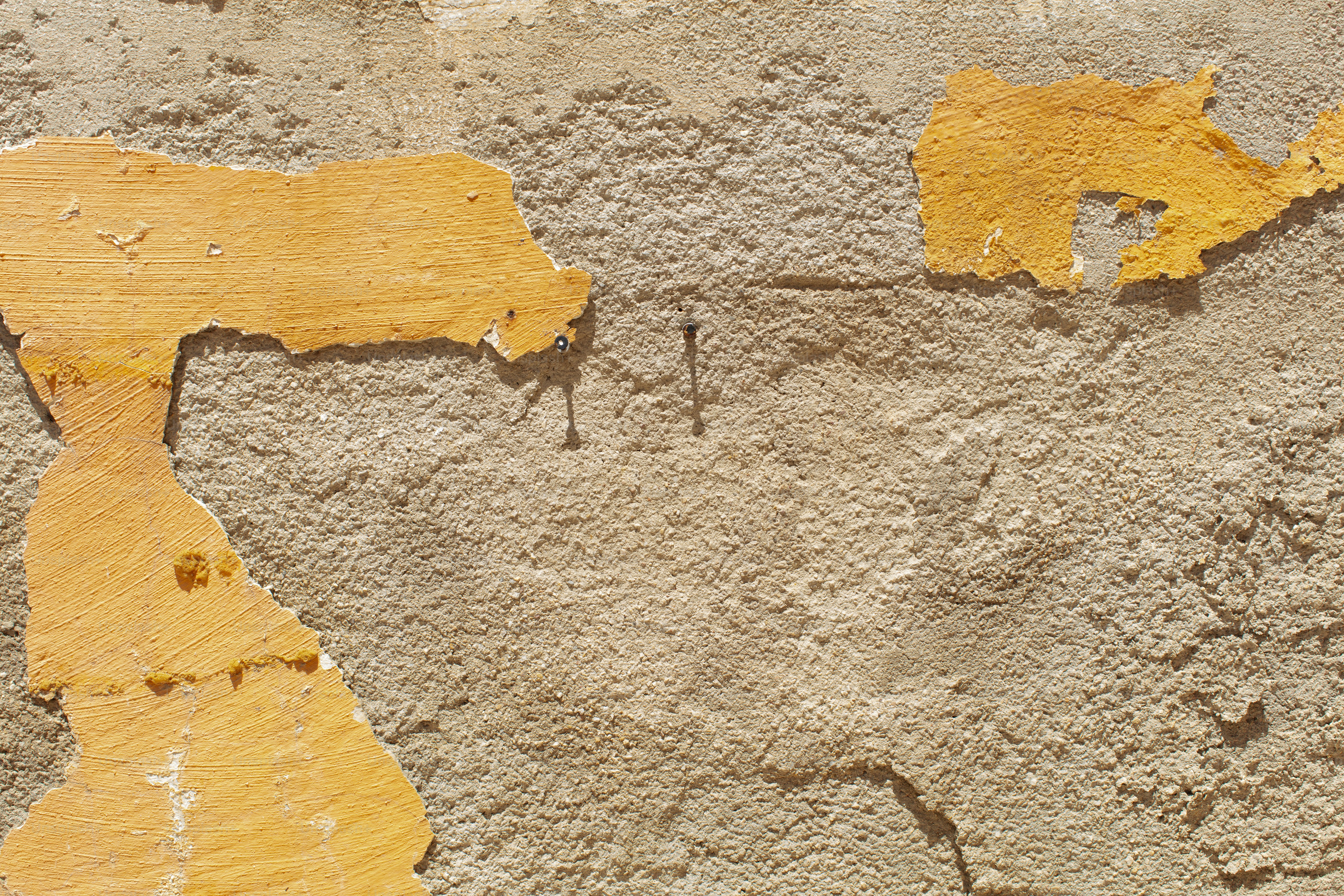 Weathered concrete wall with distinct light and dark textures. photo ...