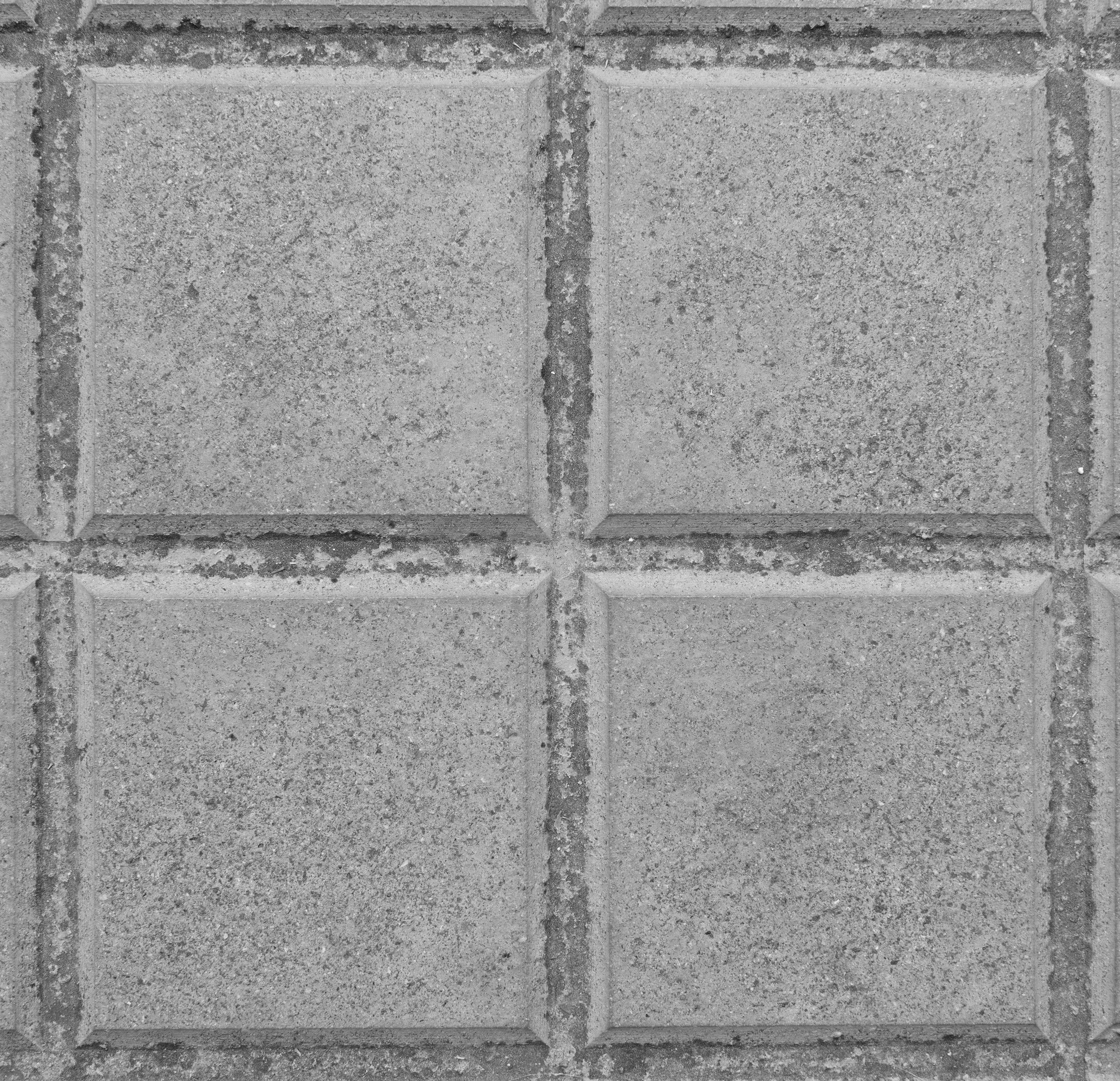 Rough, grey concrete wall with horizontal grooves and green marks ...