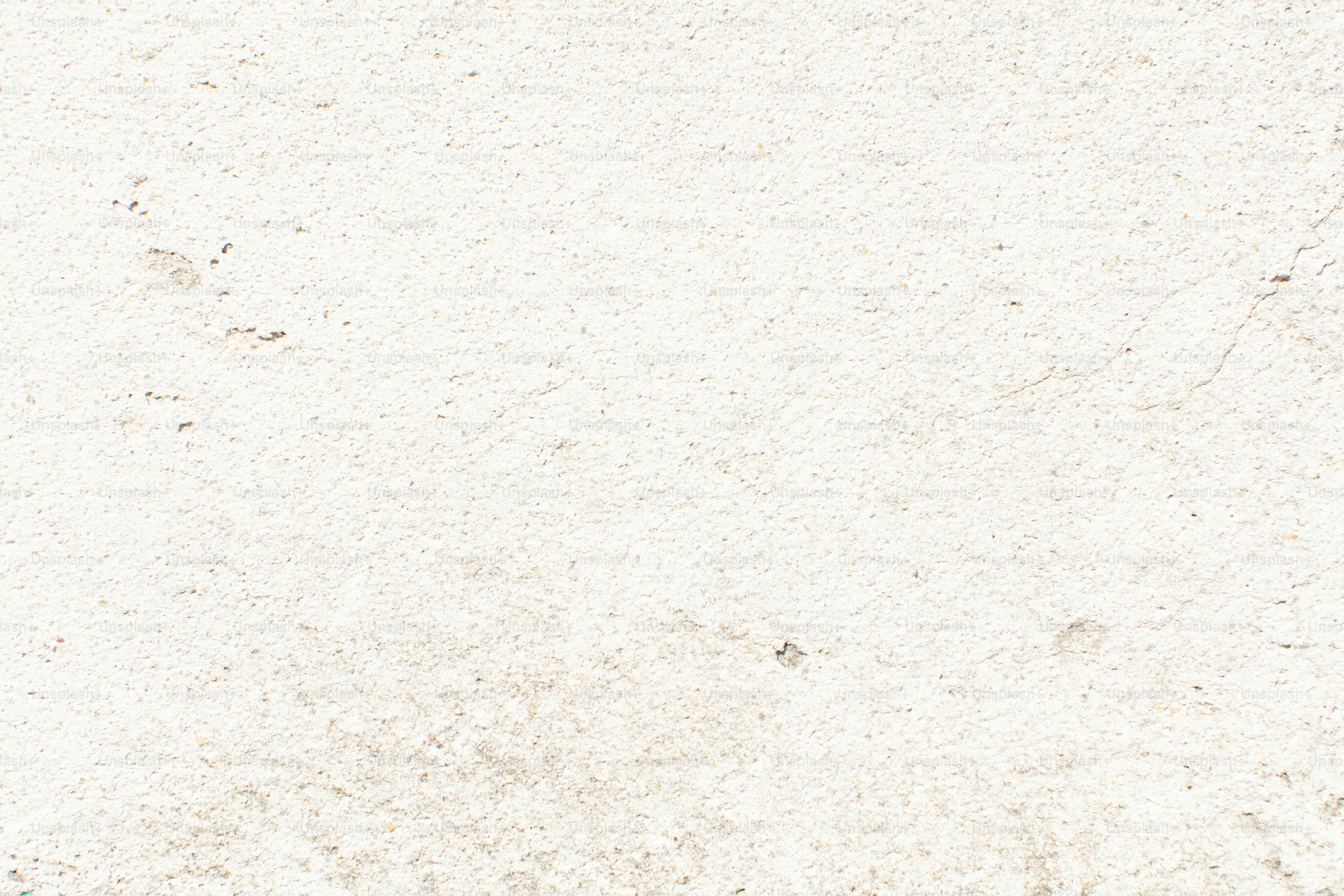 Rough, grey concrete wall with horizontal grooves and green marks ...