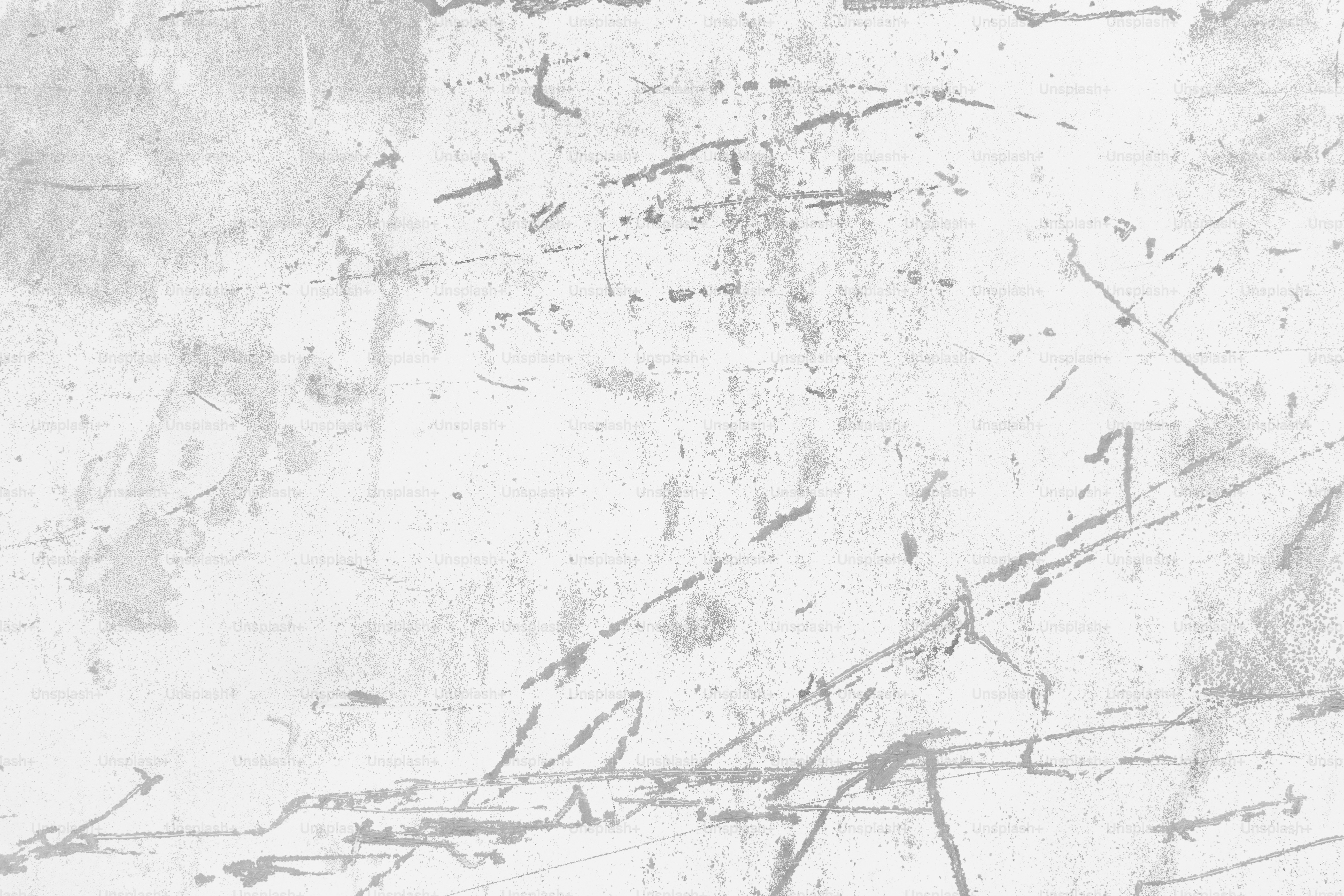 A white textured background with subtle gray scratches. photo ...