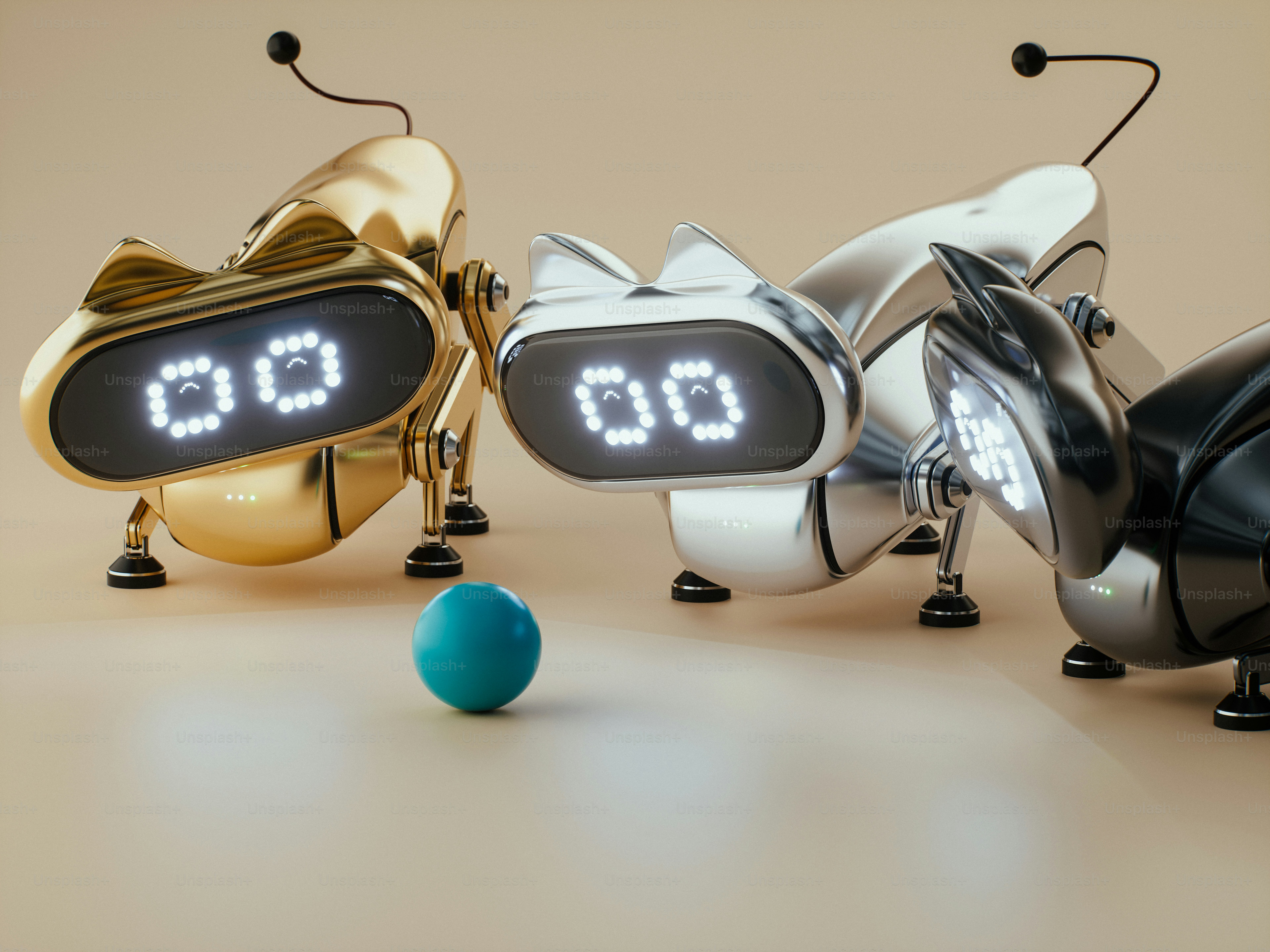 Three metallic cat-like robots observe a small blue ball. photo ...