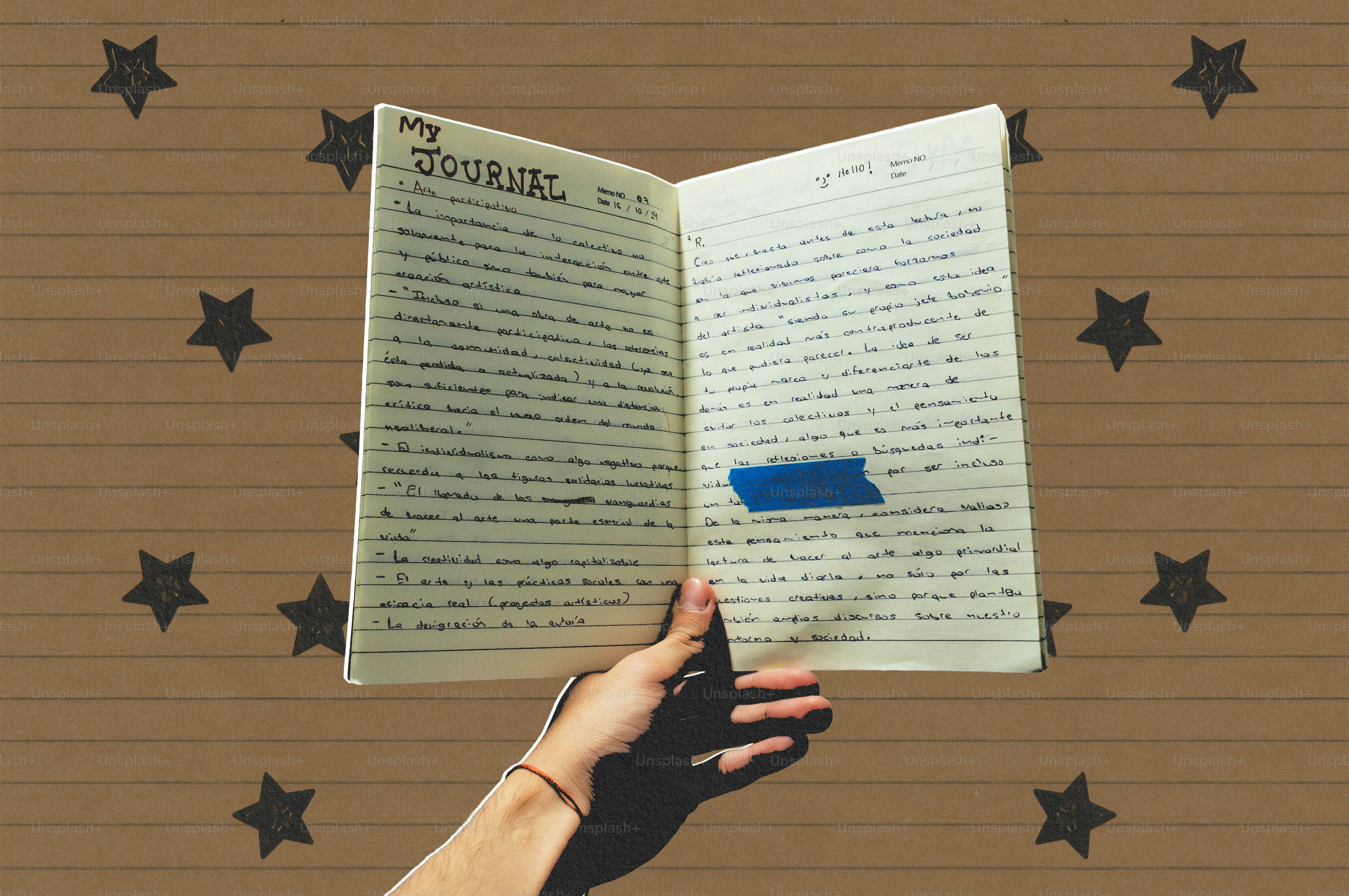 A hand writes in an open journal with a pencil. photo – Paper Image on ...