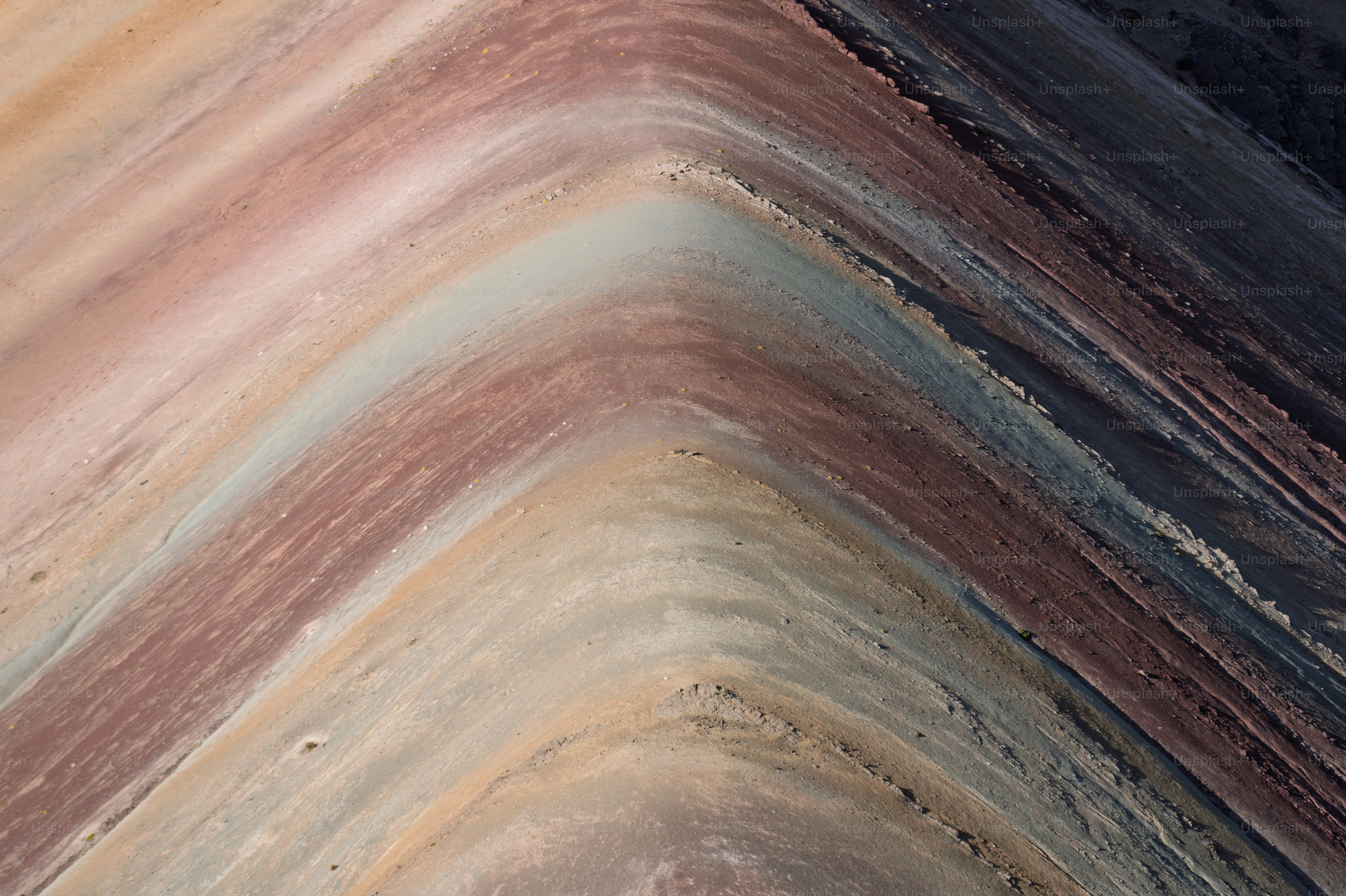 Colorful layered rock formation with a distinct v-shape. photo – Rock ...
