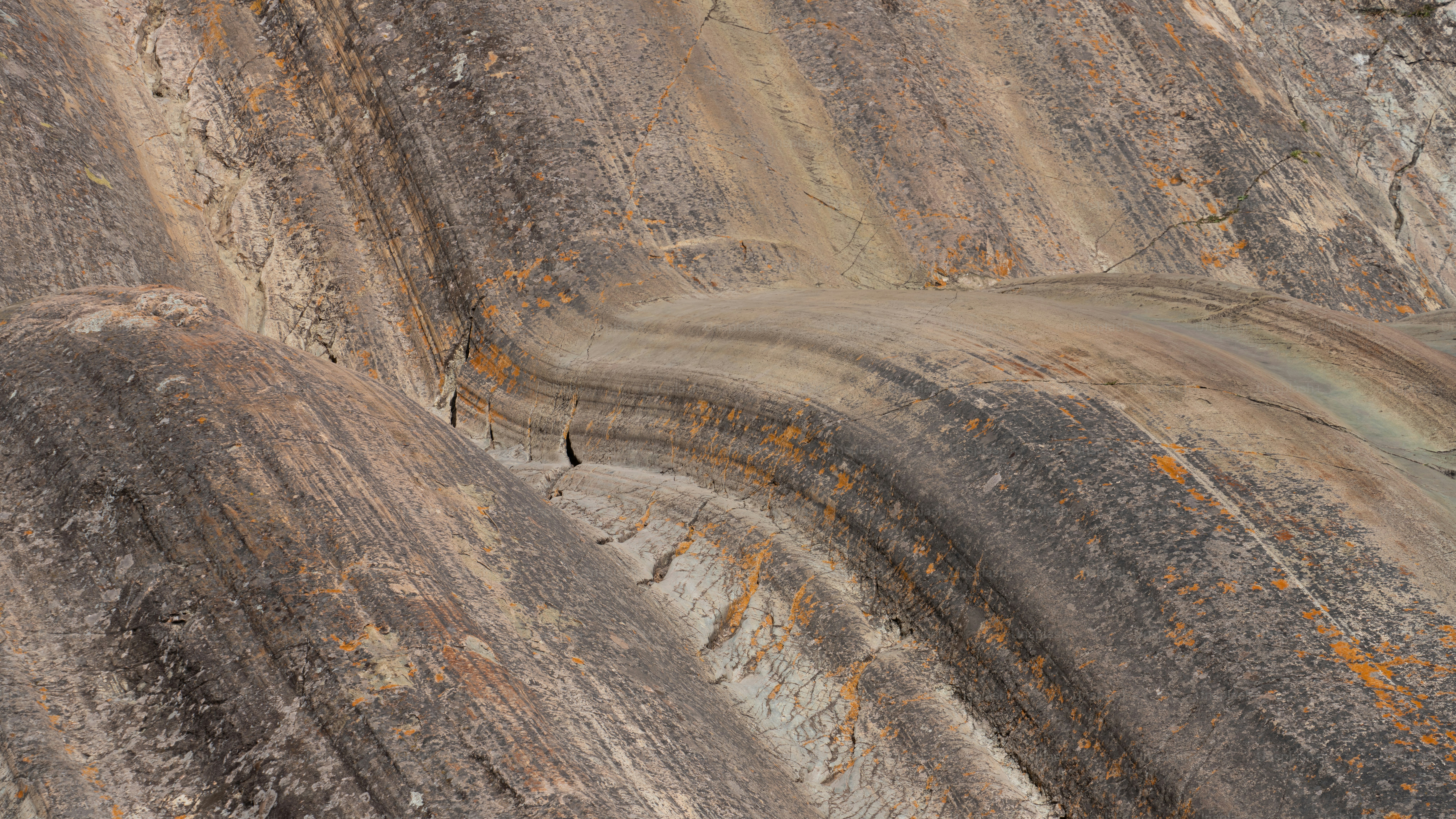Colorful layered rock formation with a distinct v-shape. photo – Rock ...