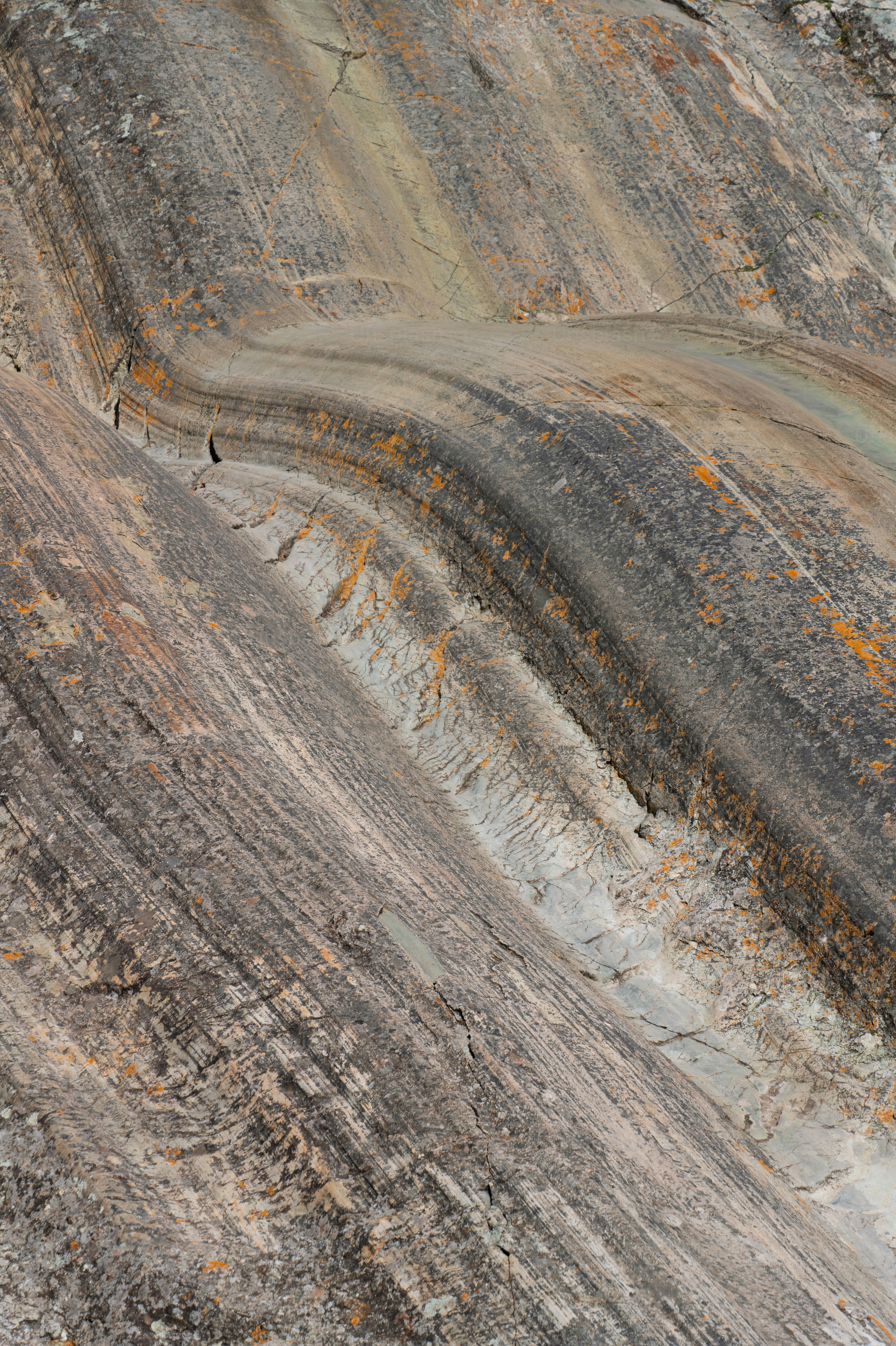 Colorful layered rock formation with a distinct v-shape. photo – Rock ...