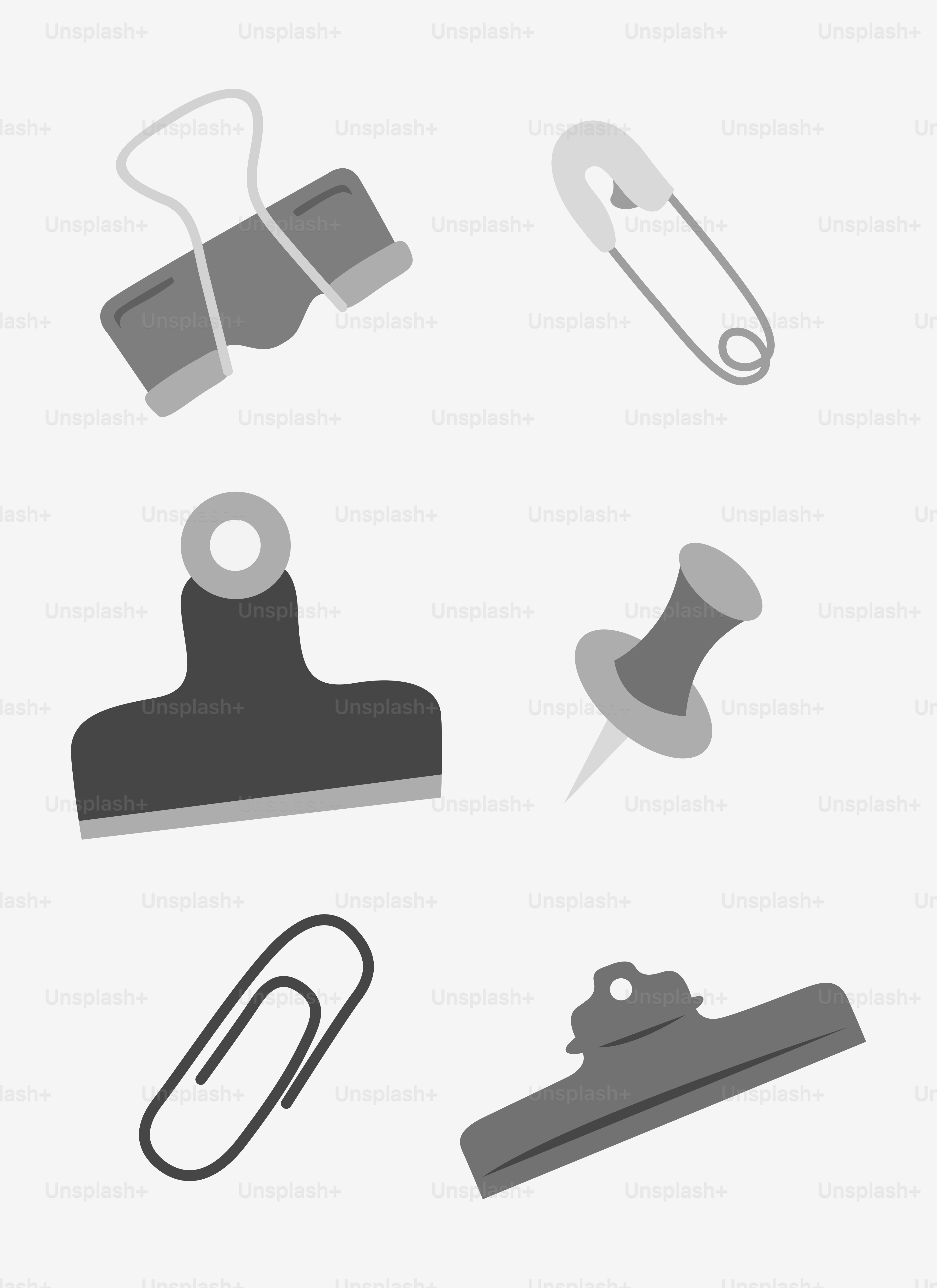 A collection of office supplies including a stapler, paper clip, and ...